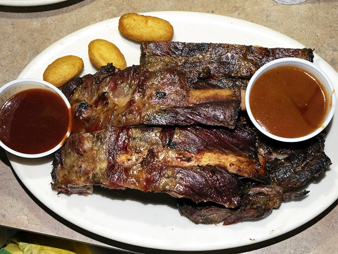 These aren't just ribs; they're a smoky manifesto with a perfect pink ring. The kind that make you question every other rib you've eaten.