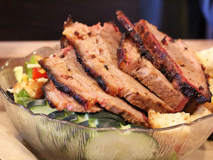 Brisket sliced so perfectly you could frame it. That smoke ring is the equivalent of a Michelin star in the BBQ universe.