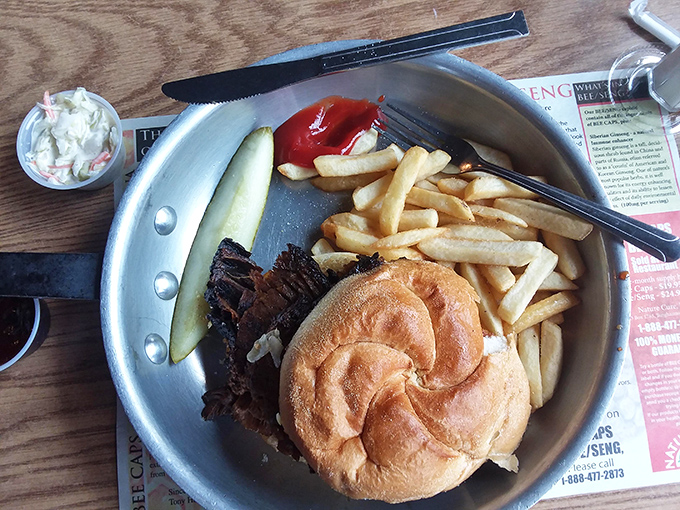 Behold the brisket sandwich in all its glory&mdash;tender meat nestled in a perfect bun, surrounded by golden fries and that obligatory pickle spear standing guard.