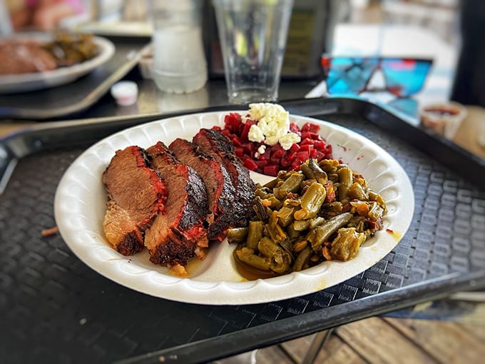 Brisket so perfectly smoked it makes you want to write poetry. The collard greens and beans aren't just sides—they're supporting actors deserving their own award.