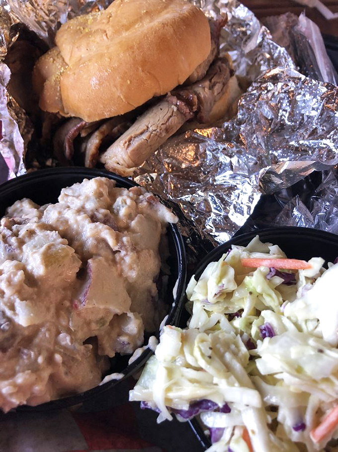 This isn't just a sandwich; it's a masterpiece of smoke and patience where beef brisket finally fulfills its highest purpose in life.