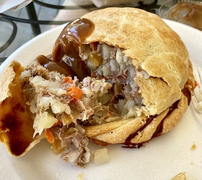 Behold the glory of a proper pasty with gravy &ndash; that golden-brown crust giving way to a steaming interior of beef and vegetables. Pure Upper Peninsula comfort on a plate.