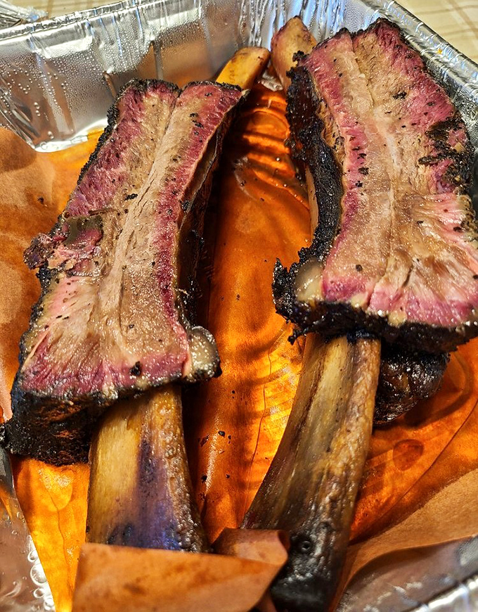 These beef ribs aren't just dinner&mdash;they're prehistoric monuments to smoke and time. The pink smoke ring is nature's way of applauding the pitmaster.