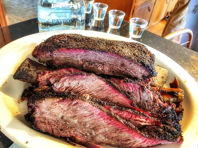 These beef ribs aren't just dinner, they're a religious experience. That smoke ring is so perfect it could teach geometry classes.