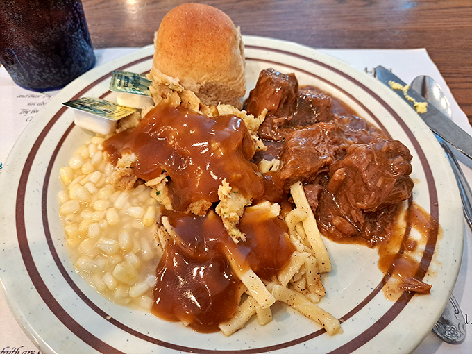 Behold the star of the show! Tender beef tips swimming in rich gravy alongside creamy mashed potatoes and sweet corn. This plate is Pennsylvania comfort in edible form.