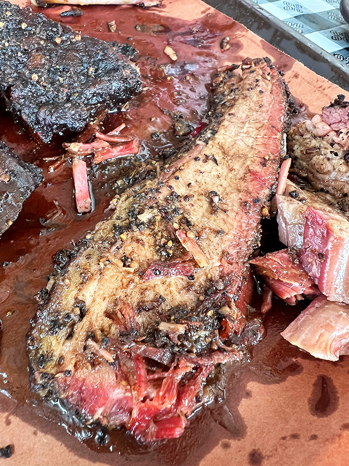 Behold the brisket in all its glory &ndash; that bark, that smoke ring, that juicy tenderness. This isn't just meat; it's a religious experience.