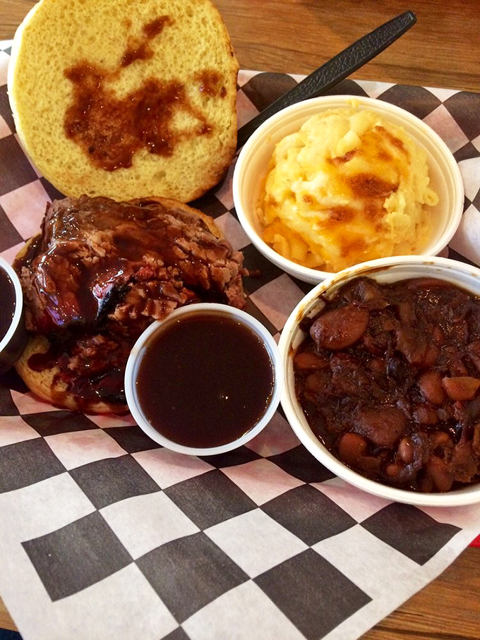 This isn't just a sandwich; it's a commitment. Tender brisket with that perfect smoke ring meets mac and cheese in a relationship worth savoring.