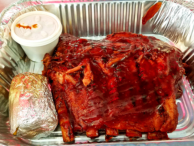 Behold the star attraction: beef ribs so magnificent they'd make Fred Flintstone jealous. That smoke ring isn't just color&mdash;it's a flavor halo.