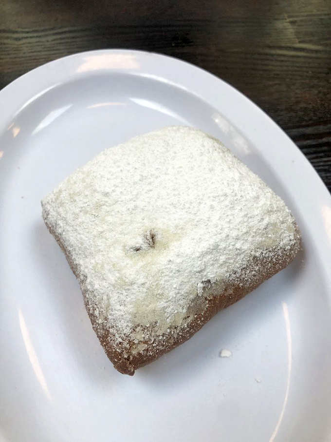 Powdered sugar snowstorm alert! This beignet doesn't just satisfy a craving &ndash; it creates a lifelong obsession that no therapist can cure.