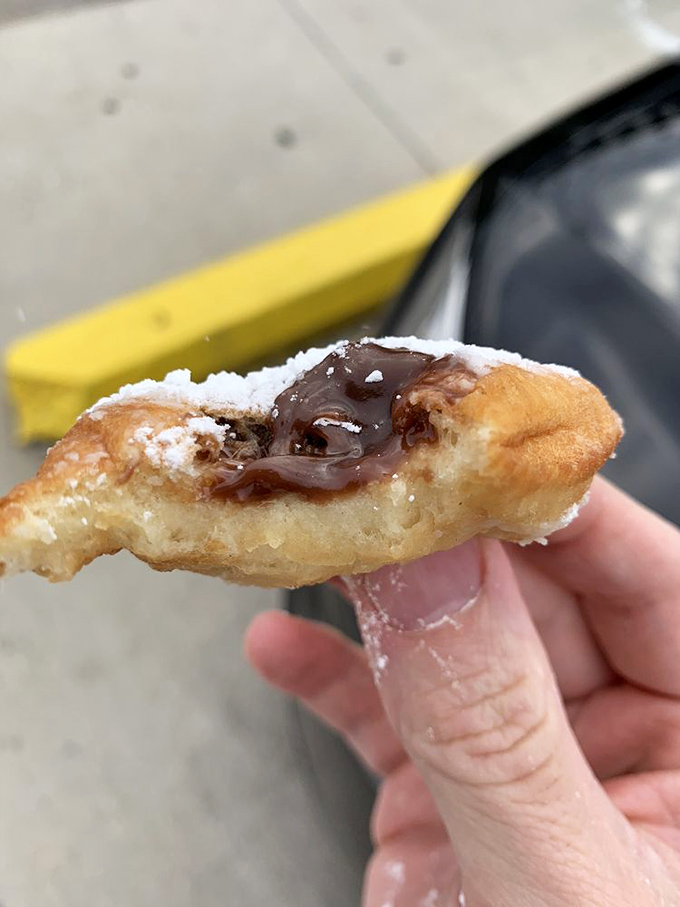 The holy grail of Joe Patti's—a pillowy beignet with chocolate filling that's worth every powdered sugar stain on your shirt. Diet plans, beware.
