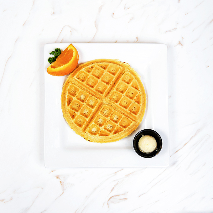 Golden perfection meets geometric precision. This Belgian waffle doesn't need fancy toppings to make its point—it's confident in its crispy-fluffy duality.