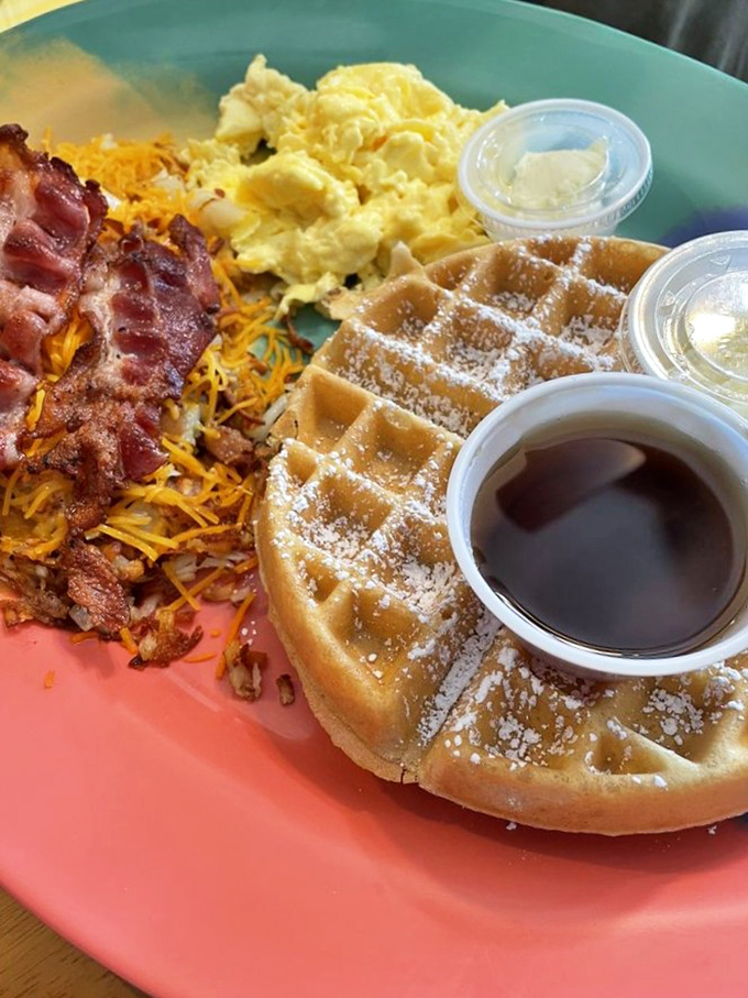 Golden Belgian waffle perfection meets crispy bacon and fluffy eggs&mdash;the breakfast trinity that makes getting out of bed worthwhile.