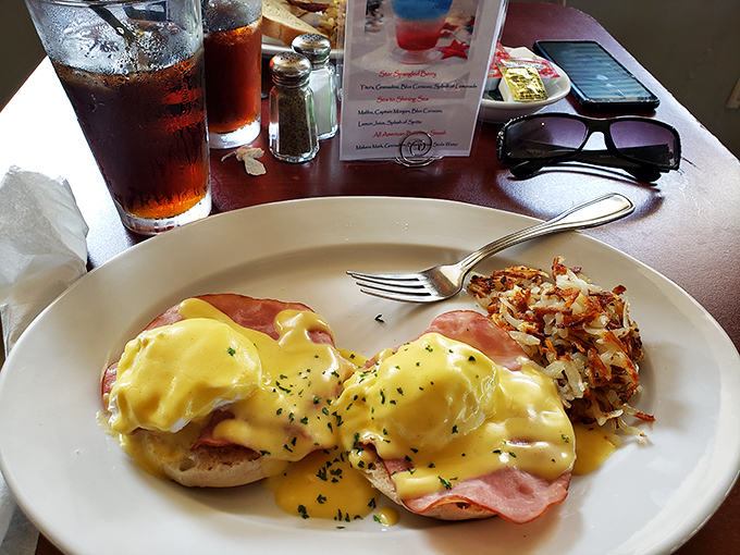 Behold, the star of the show! This eggs Benedict features perfectly poached eggs draped in sunshine-yellow hollandaise that would make Julia Child weep with joy.