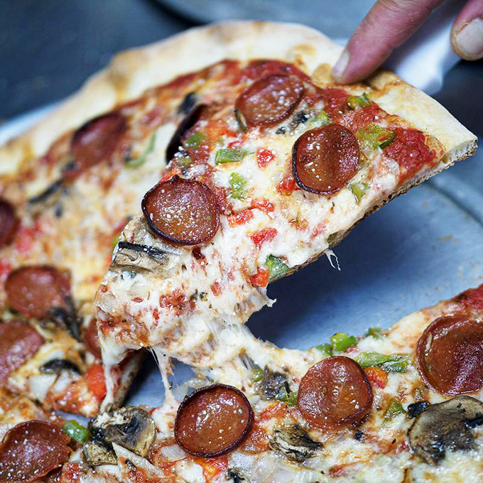 The cheese pull doesn't lie. When your pizza stretches like an Olympic gymnast, you know you've found the real deal.