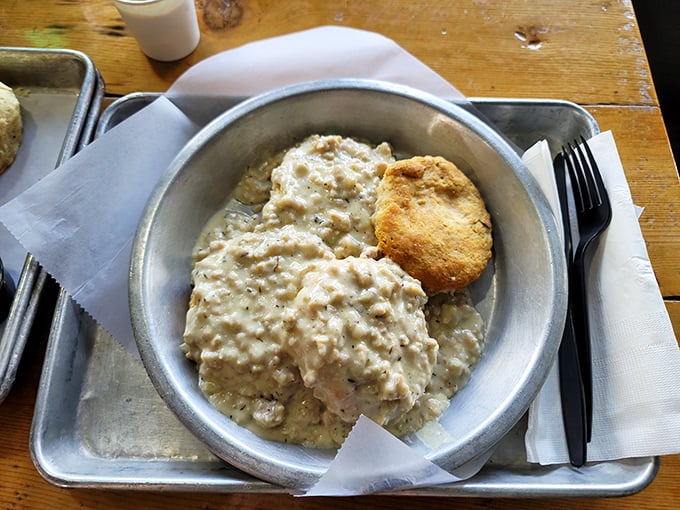 Behold: the biscuit and gravy mothership has landed. That golden-brown island of biscuit swimming in a sea of creamy thyme-flecked gravy is calling your name.