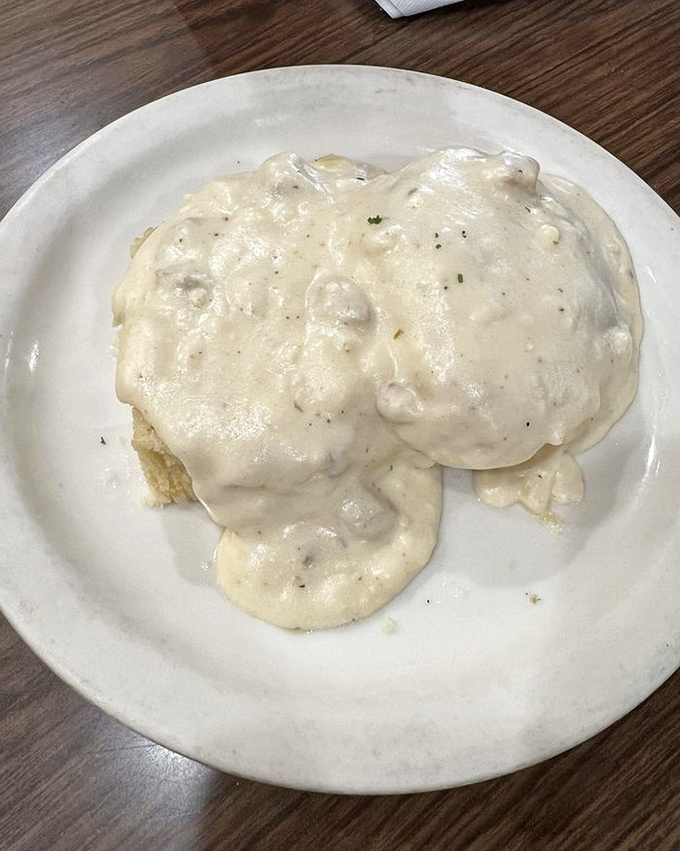 Behold the star of the show: biscuits and gravy that could make a grown adult weep with joy. Creamy, peppery perfection atop cloud-like biscuits.