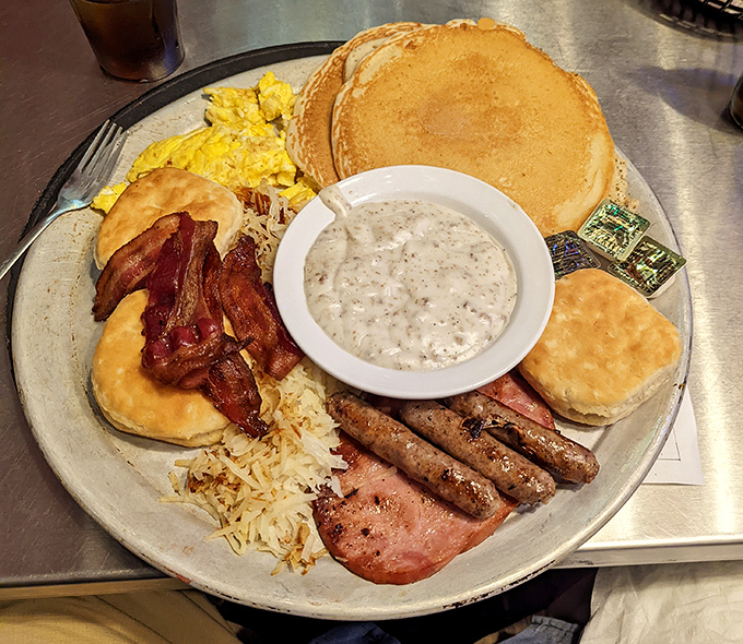 Breakfast nirvana achieved! This platter doesn't just feed you&mdash;it hugs your soul with pancakes, eggs, and gravy that would make your grandmother jealous.