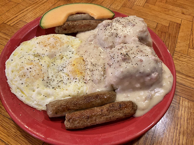 Behold the legendary biscuits and gravy – a creamy, peppery masterpiece that's converted more breakfast skeptics than Sunday morning infomercials.