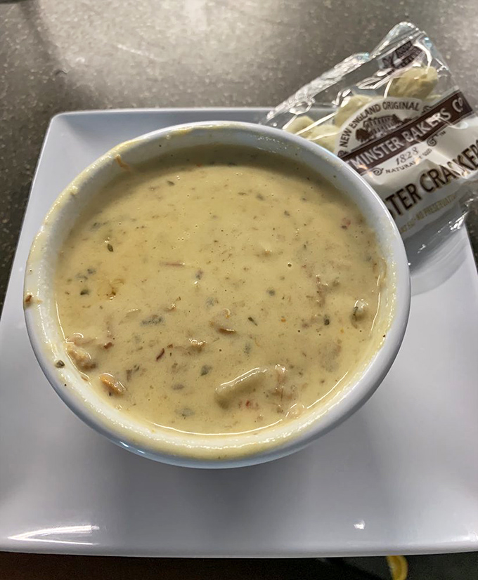 The legendary blue crab chowder arrives like a creamy treasure chest, packed with sweet crab morsels that'll have you contemplating a second bowl before finishing the first.