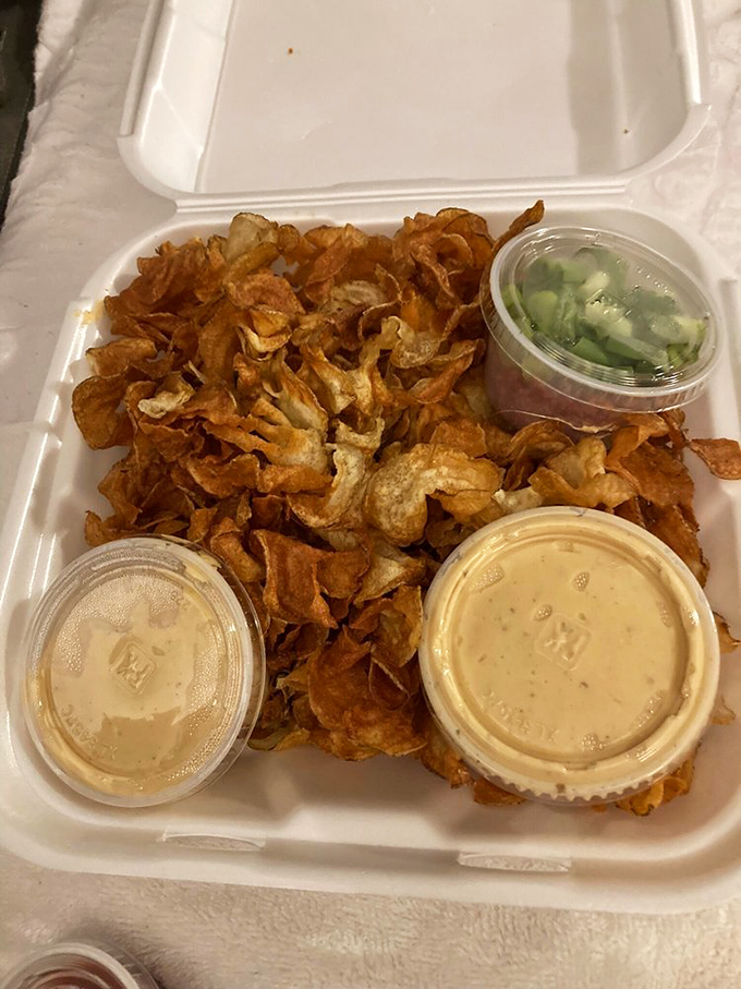 Homemade chips arrive with dipping sauces that make you question why you've wasted time on inferior nachos your entire life.