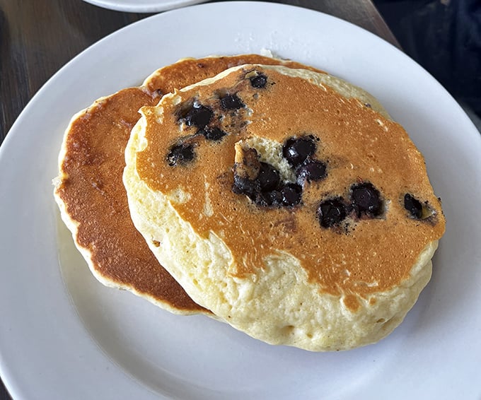 These blueberry pancakes aren't just breakfast, they're edible poetry&mdash;golden-brown canvases dotted with bursts of berry that make Monday mornings bearable again.