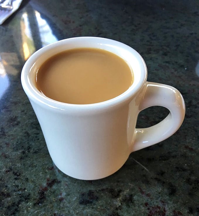 The humble white mug holds liquid ambition&mdash;bottomless coffee that's fueled Glendale's dreams for decades. No fancy latte art, just honest caffeine commitment.