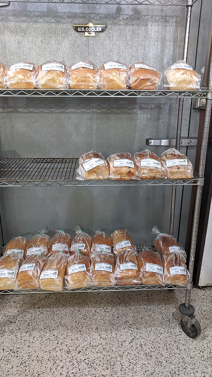 Bread nirvana exists, and it's on these metal shelves. Each loaf sits patiently, knowing its destiny is to make your ordinary sandwich extraordinary.
