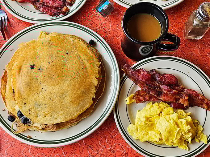 Blueberry pancakes that could make your grandma jealous, paired with perfectly scrambled eggs and bacon that's achieved that mythical balance between crispy and chewy.