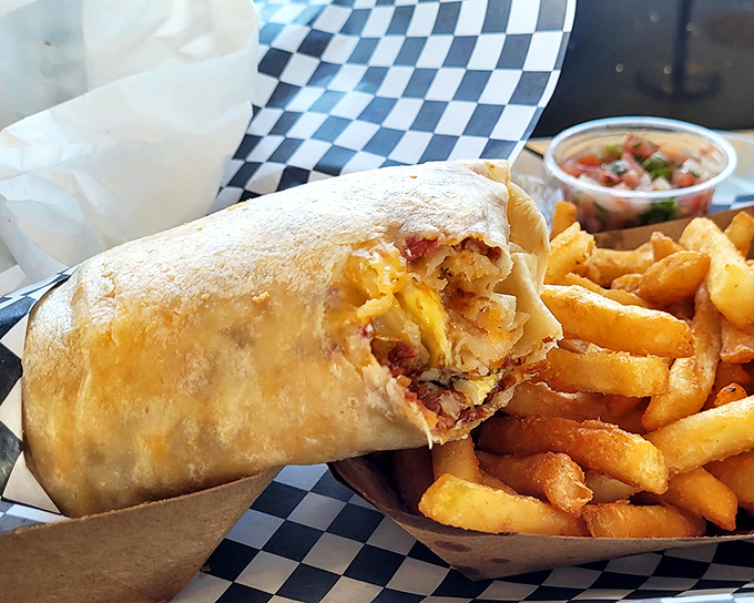 Behold the breakfast burrito in its natural habitat&mdash;perfectly grilled, stuffed with morning magic, and flanked by golden fries that demand attention.
