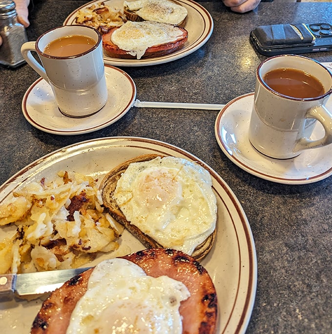 Morning glory on a plate! Eggs, home fries, and that essential cup of diner coffee &ndash; the breakfast trinity that's launched a thousand productive days.