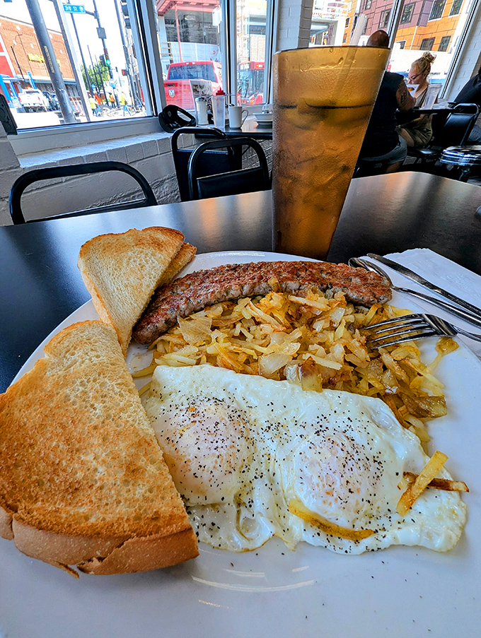 Breakfast perfection on a plate: eggs with just the right amount of pepper, golden hash browns, and toast that makes you question all other bread experiences.