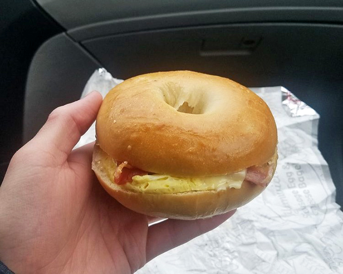 This isn't just breakfast &ndash; it's edible architecture. A perfectly toasted bagel cradles eggs and ham in a handheld masterpiece that puts fast food to shame.