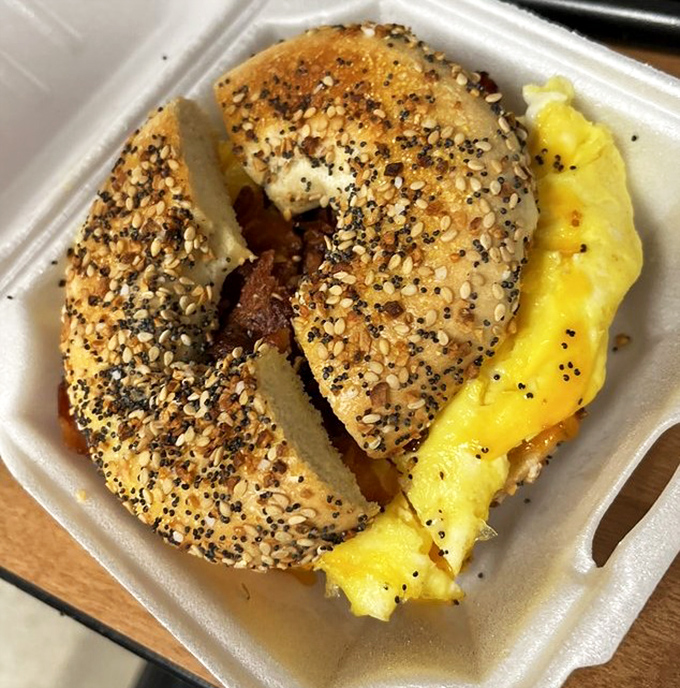 The everything bagel sandwich&mdash;where seeds, eggs, and meat perform a breakfast ballet so perfect you'll forget you're eating from a takeout container.