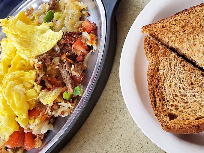 Breakfast alchemy at its finest—where eggs, meat, and veggies perform a morning dance that puts your cereal routine to shame.