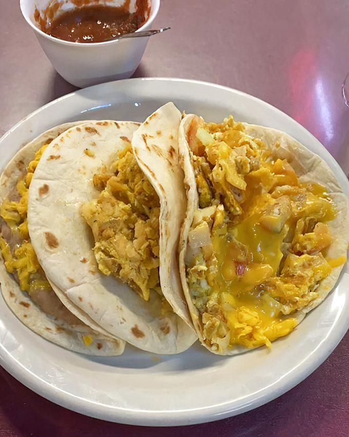 Breakfast tacos that make you question every other breakfast you've ever had. The cheese melts into the eggs like they're having their own little fiesta.