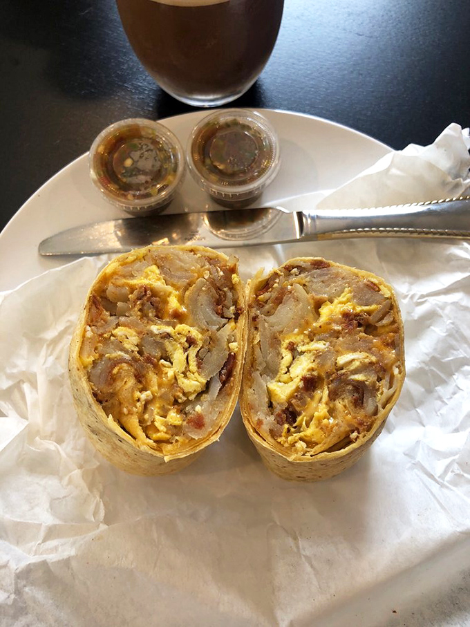 Behold the cross-section of perfection: eggs, potatoes, and pure morning happiness wrapped in tortilla heaven.