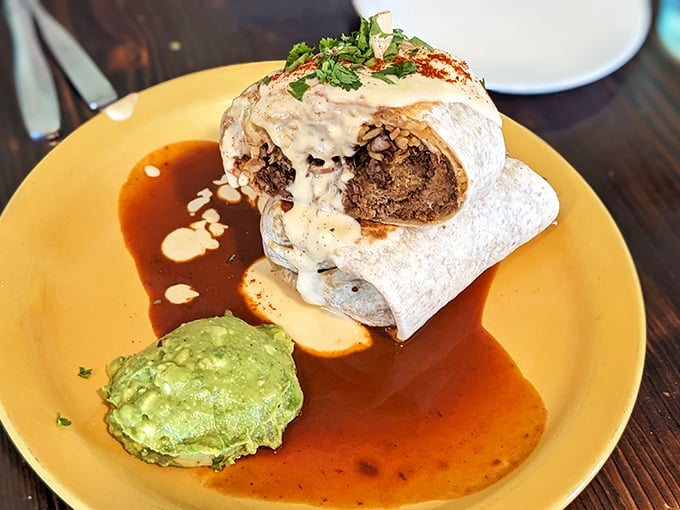 This isn't just a breakfast burrito; it's morning salvation wrapped in a tortilla, complete with a side of guacamole that deserves its own fan club.