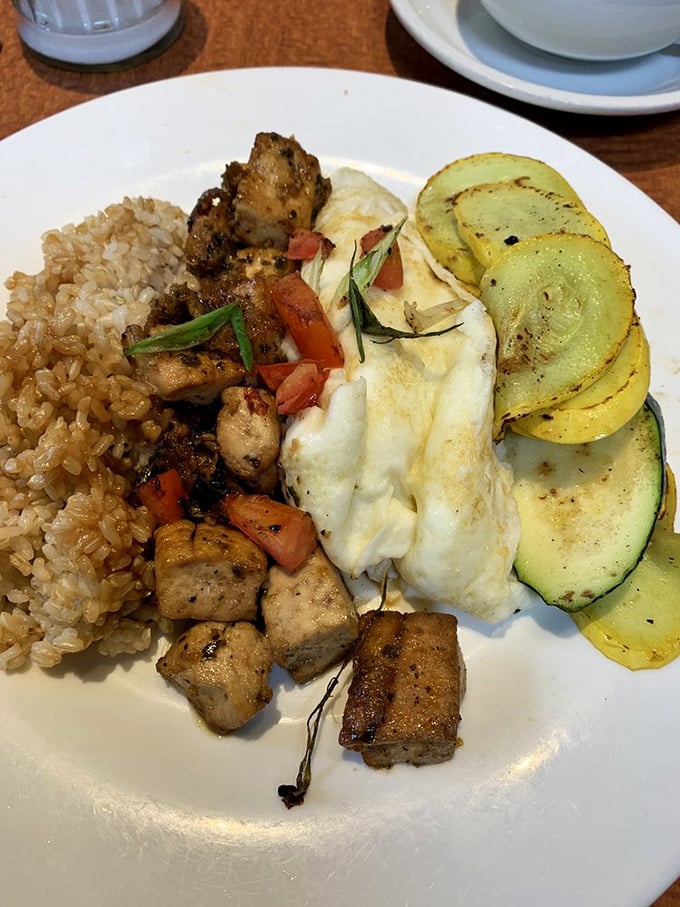 Zen Breakfast perfection: brown rice, seasoned tofu, and eggs create a harmony that proves healthy eating doesn't require a sacrifice of flavor.