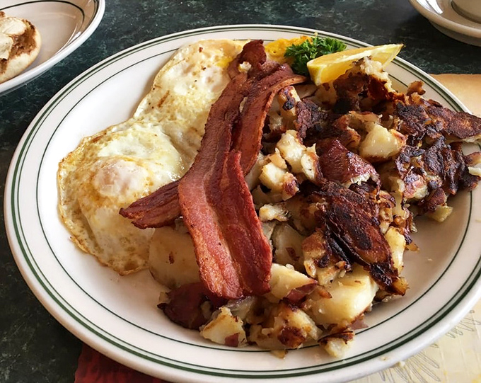 Sunny-side eggs, crispy bacon, and those legendary home fries that somehow taste better than any potato has a right to. Breakfast nirvana achieved.