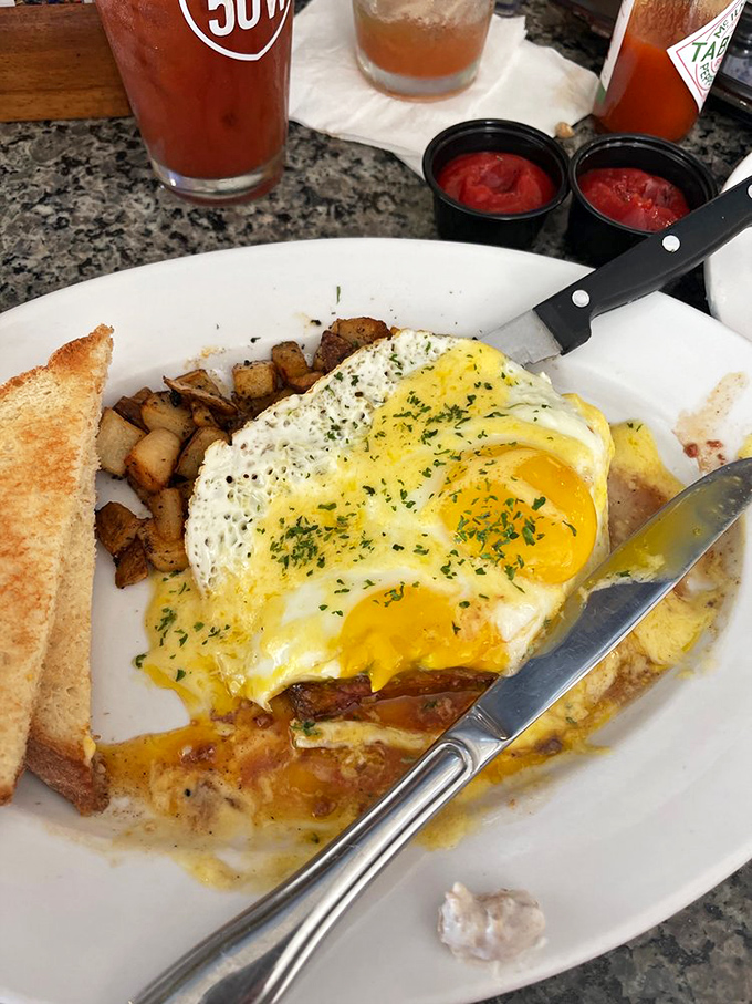 Breakfast nirvana: perfectly runny eggs, crispy home fries, and toast ready for dipping. The holy trinity of morning satisfaction!