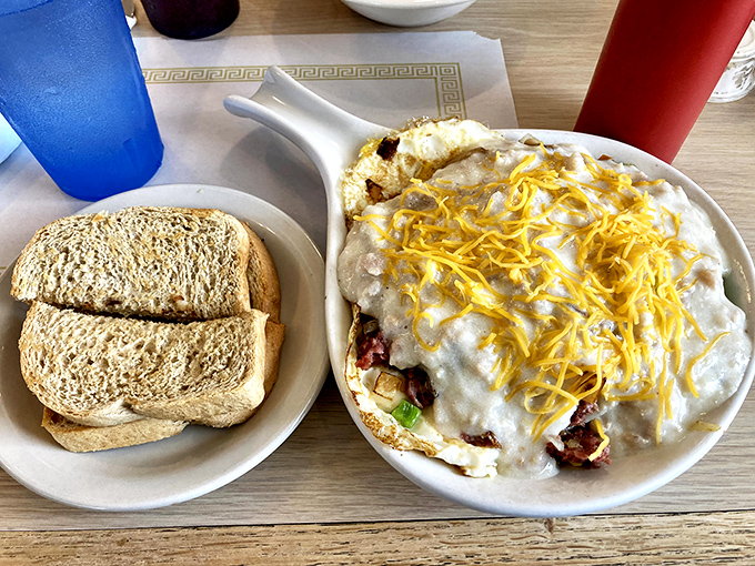 This breakfast skillet is what morning dreams are made of—cheese-crowned comfort that says "your diet can start tomorrow."