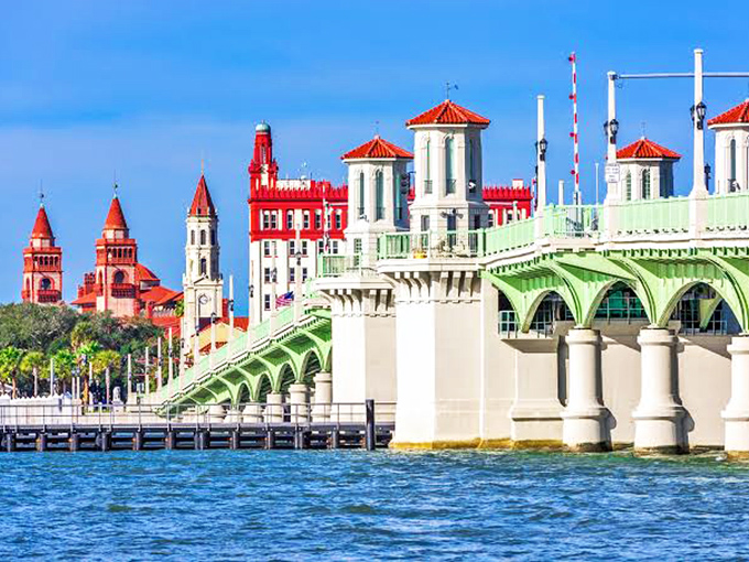 The Bridge of Lions spans the Matanzas Bay with mint-green elegance, connecting mainland St. Augustine to Anastasia Island like a postcard come to life.