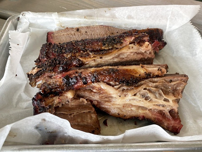 Behold, the holy grail of smoked meats. This brisket's bark is the result of time, patience, and pitmaster wisdom that would make Texas nod in approval.