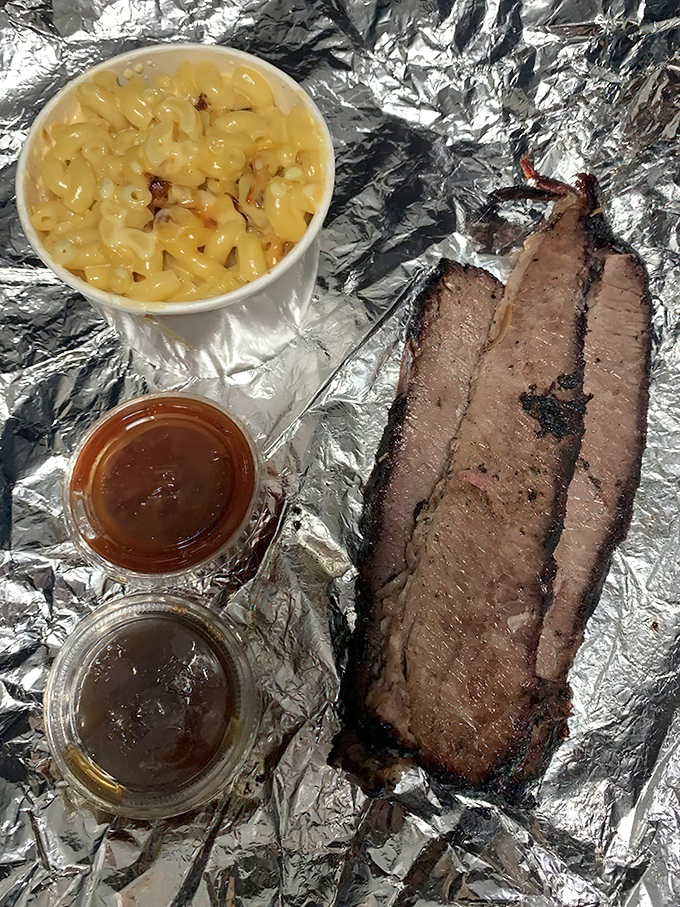 Brisket that would make a Texan weep tears of joy. That smoke ring isn't just for show&mdash;it's a pink badge of honor earned through patience and fire.