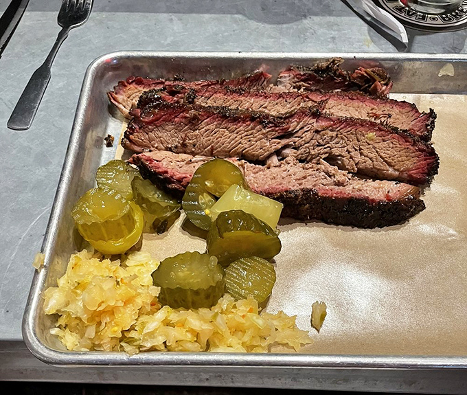 Brisket so perfect it makes Texans nervous. That smoke ring isn't just for show&mdash;it's a halo of flavor that's earned its place.