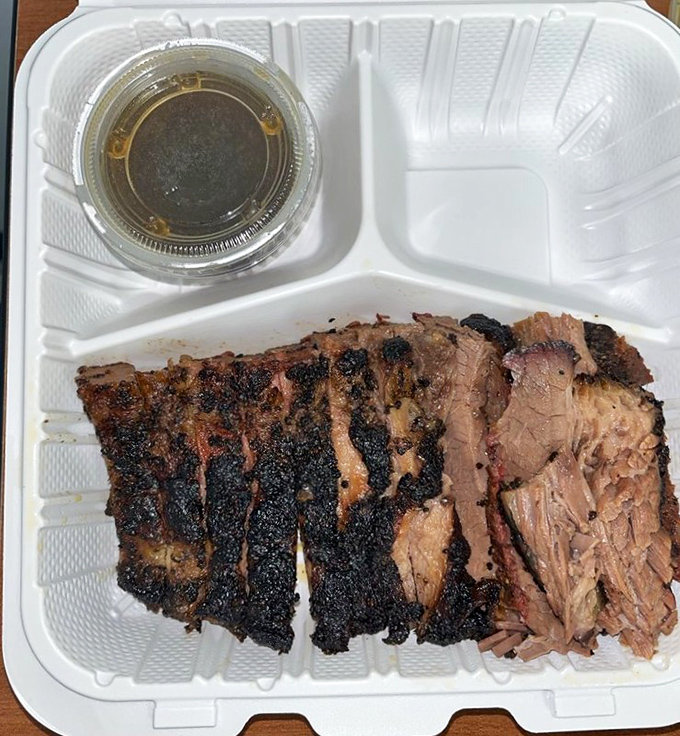 Brisket with a bark so perfect it should be in a museum. That smoke ring isn't just pink&mdash;it's the BBQ equivalent of a Michelin star.