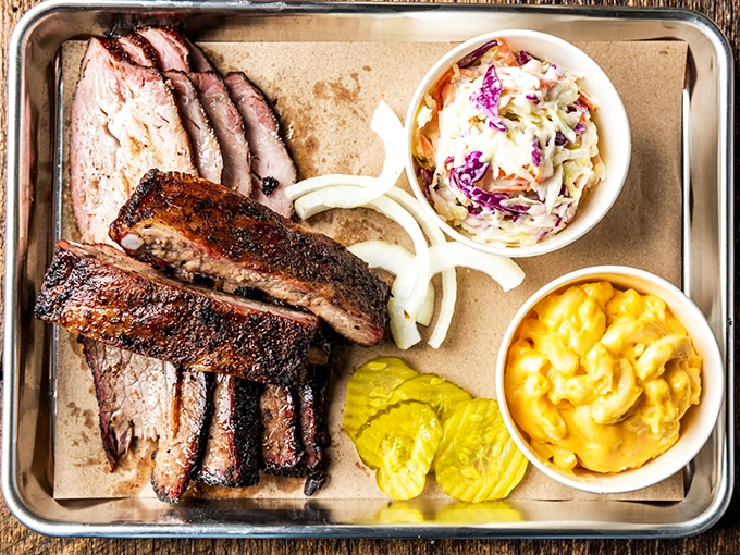 This brisket glistens like a mahogany masterpiece, with a smoke ring that could make angels weep.