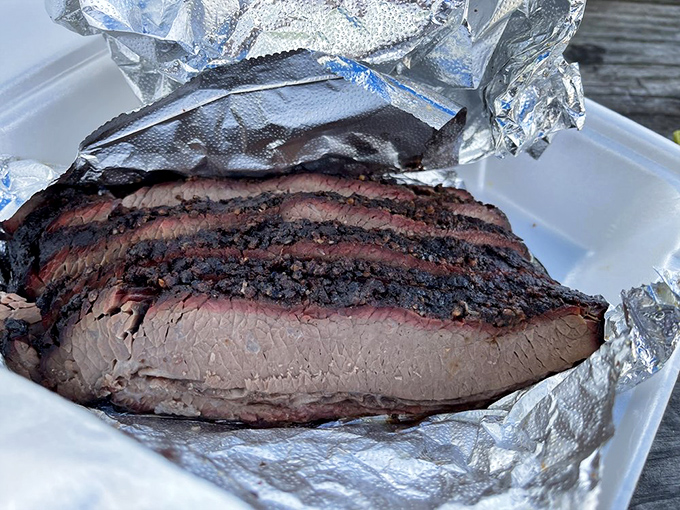 Brisket that would make a Texan weep with joy. That bark, that smoke ring, that tenderness&mdash;it's meat poetry wrapped in foil.