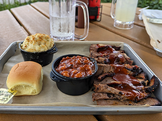 Behold the brisket plate in all its glory &ndash; tender slices of smoky perfection flanked by mac and cheese that's clearly been living its best life.