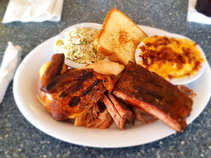 Barbecue perfection doesn't need fancy plating. This combo plate with ribs, pulled pork, slaw, and mac and cheese speaks a universal language of comfort.